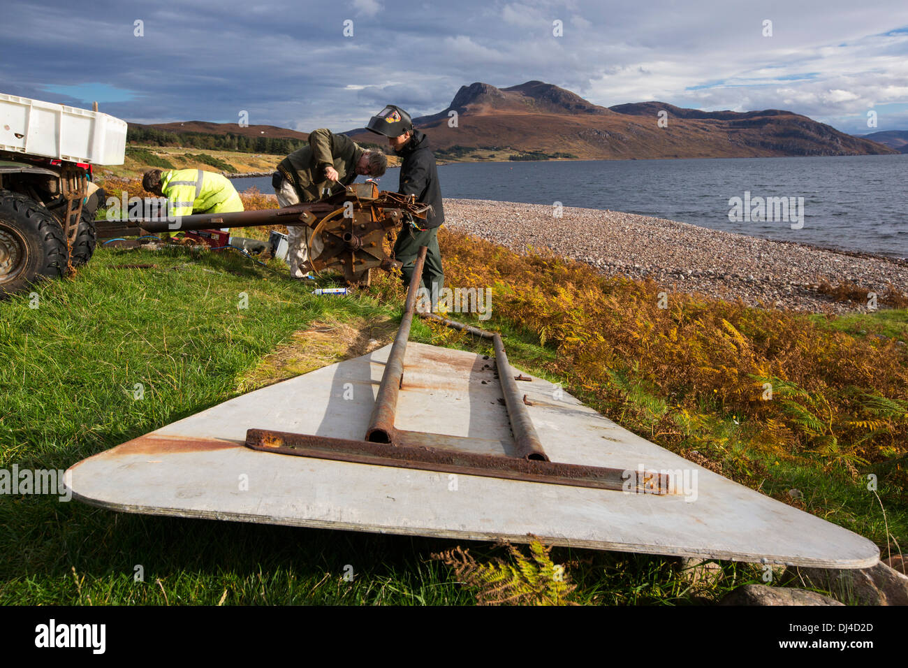 Hugh Piggott doing maintenance on his home made wind turbines in ...