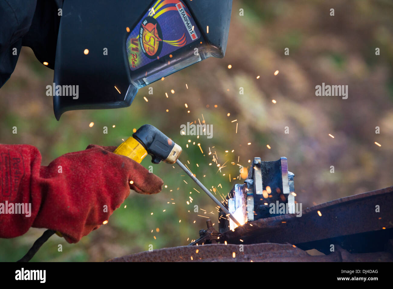 Hugh Piggott doing maintenance on his home made wind turbines in ...