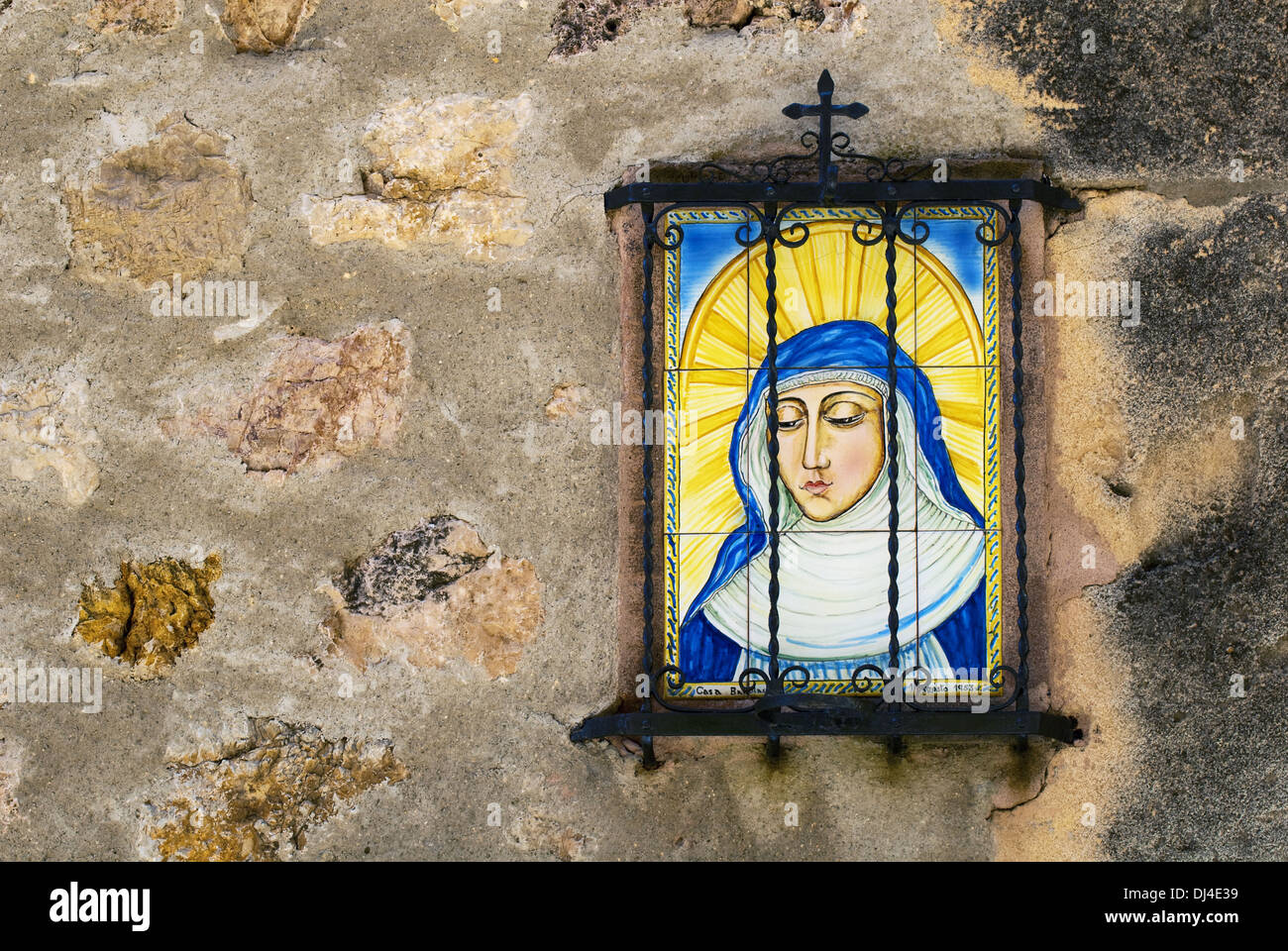 Icon on a wall Stock Photo - Alamy