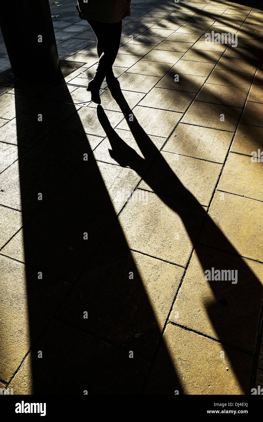 Shadows cast people walking hi-res stock photography and images - Alamy