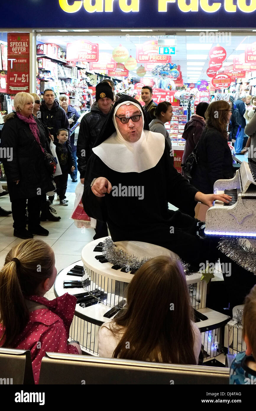Musical Ruth, a street entertainer performing in a shopping centre in ...