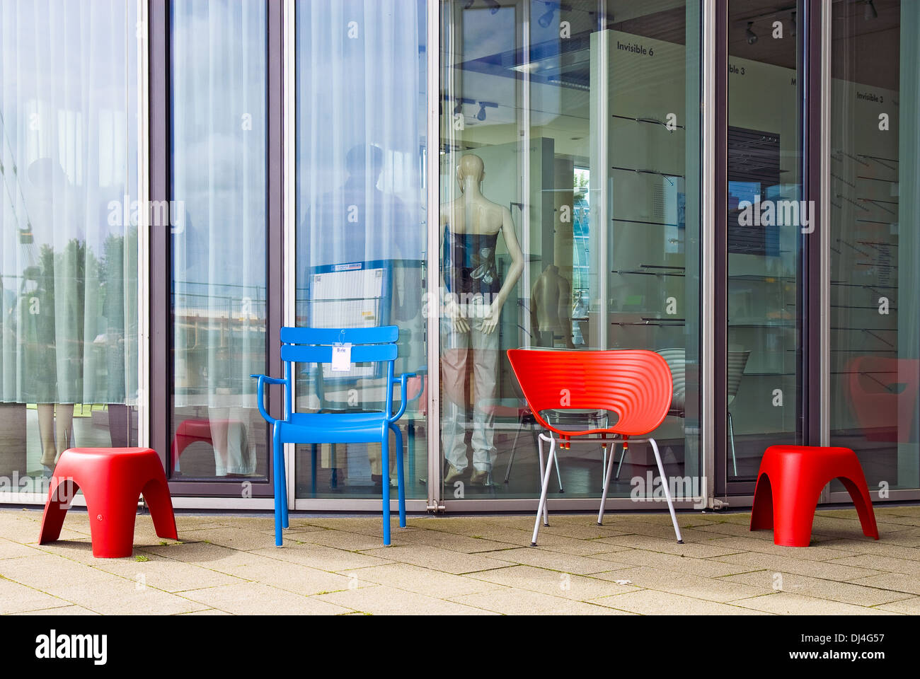 Chairs in front of a shop window Stock Photo - Alamy