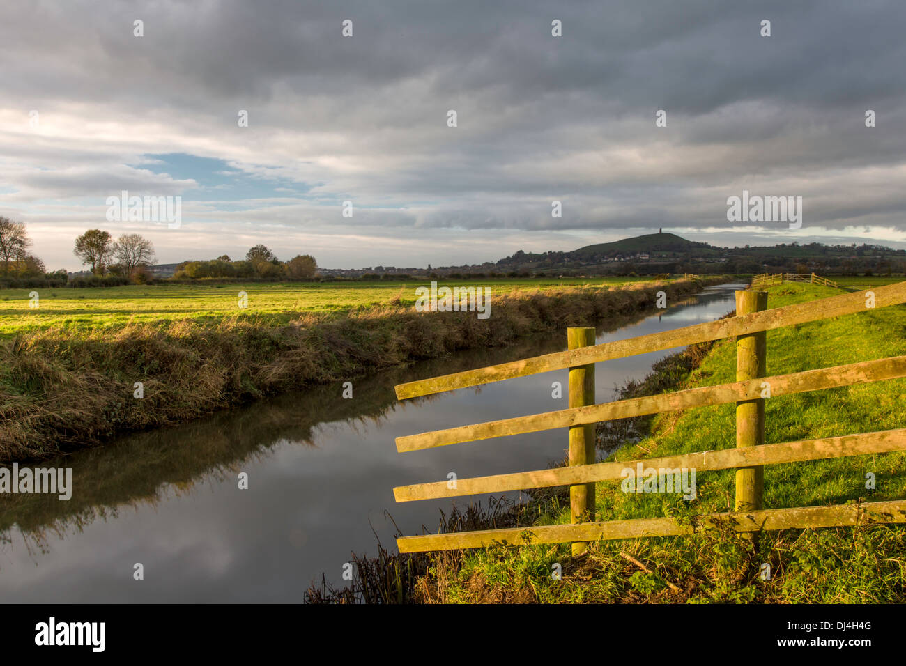 Evening light on the River Brue and the distant Glastonbury Tor ...