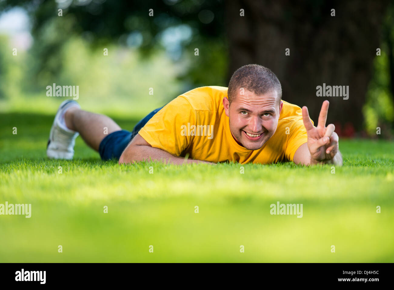 Young Men Showing Peace Sign Stock Photo - Alamy