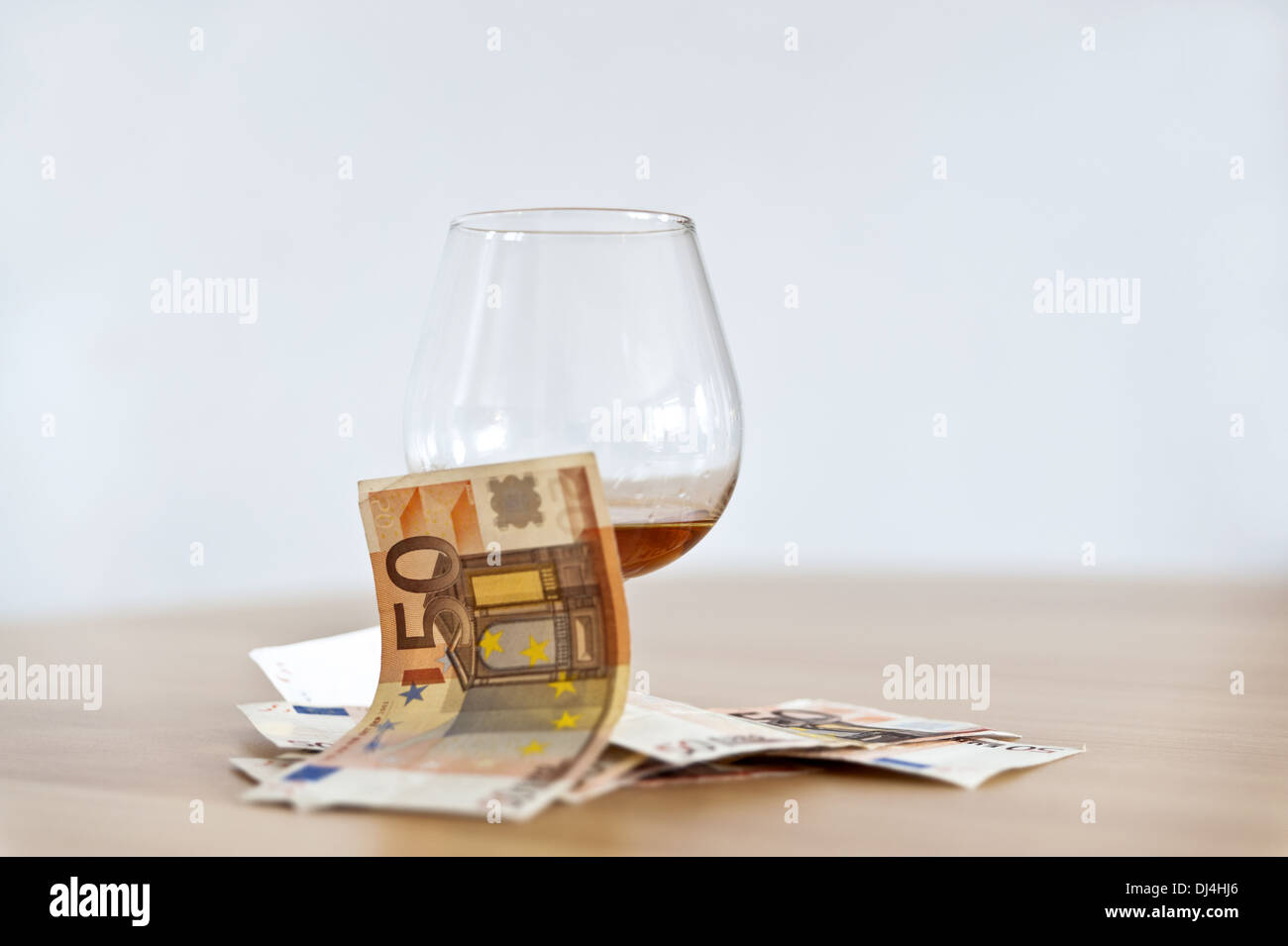 Alcohol and money Stock Photo - Alamy