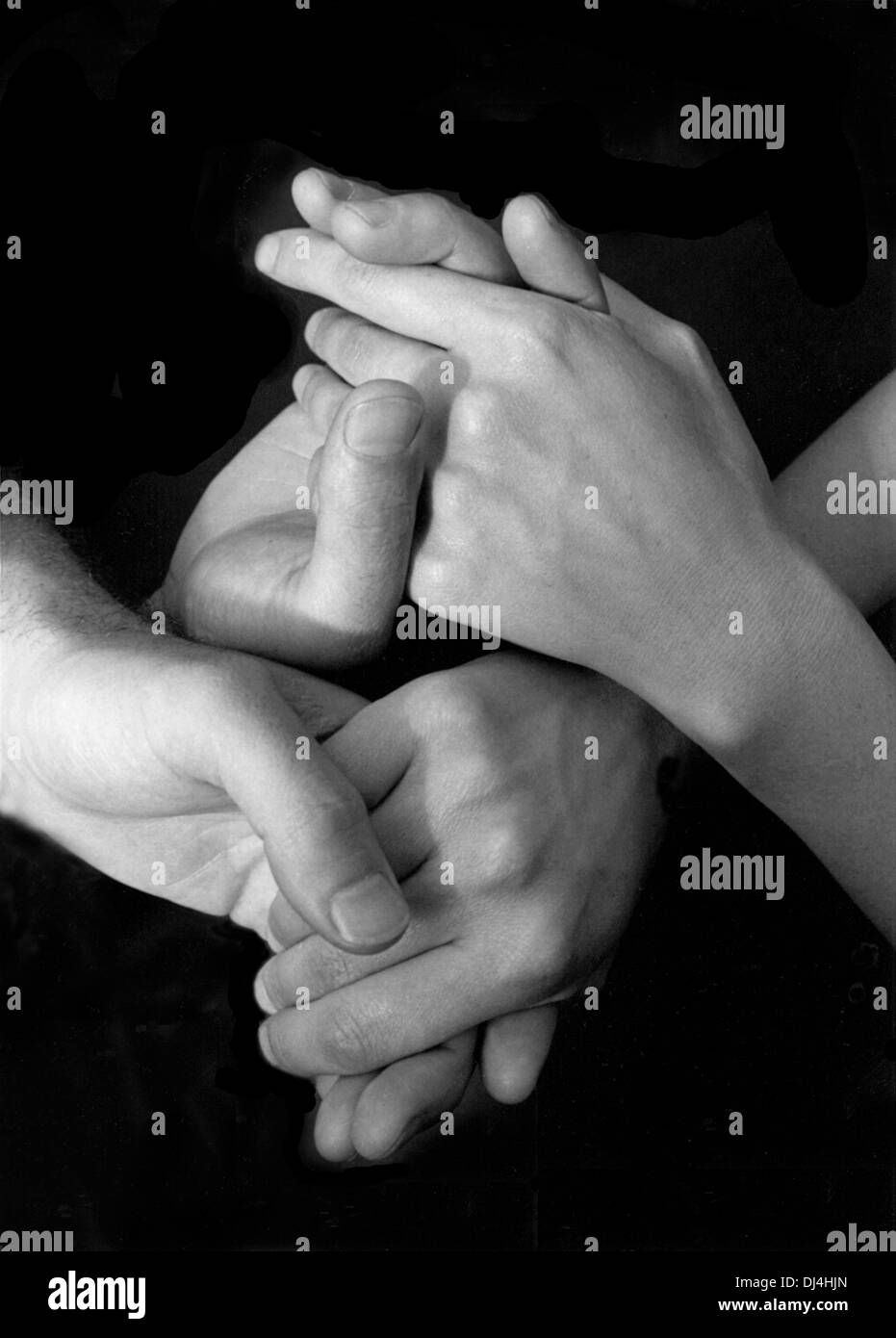 Interwoven hands hi-res stock photography and images - Alamy