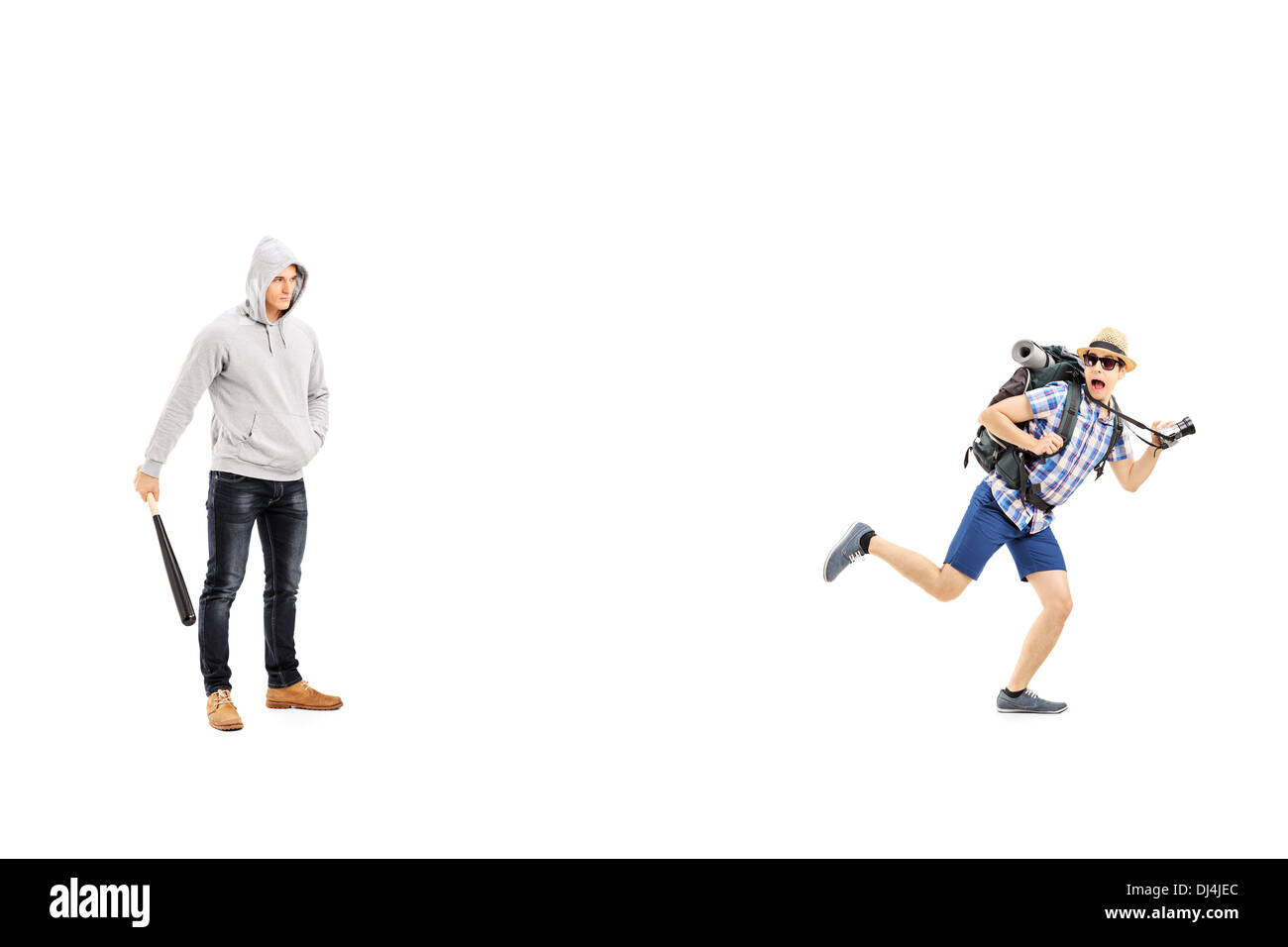 Guy with hood over his head holding a baseball bat and scared tourist ...