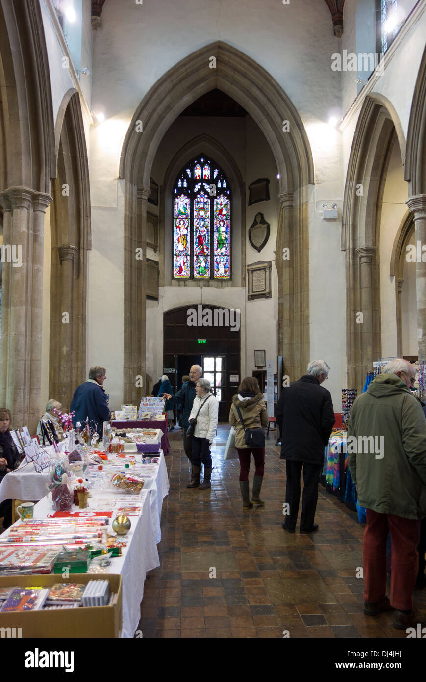Deconsecrated church: stallholders and visitors at a craft fair inside ...