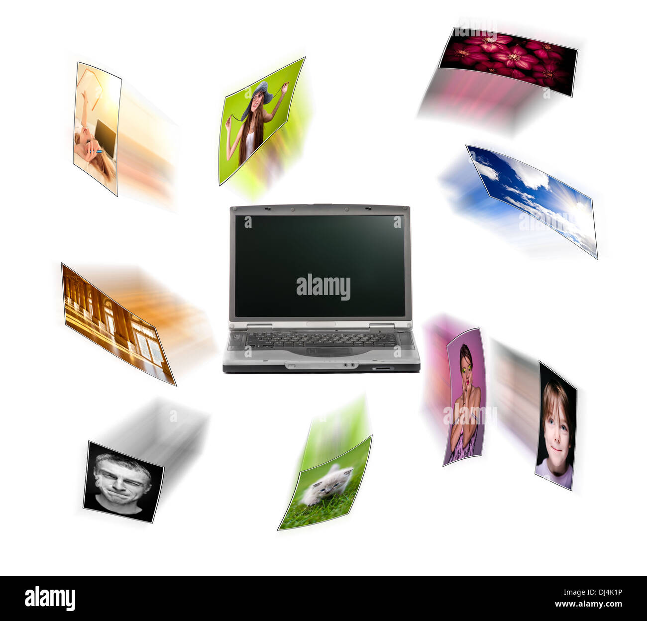 A laptop and digital pictures flying Stock Photo - Alamy