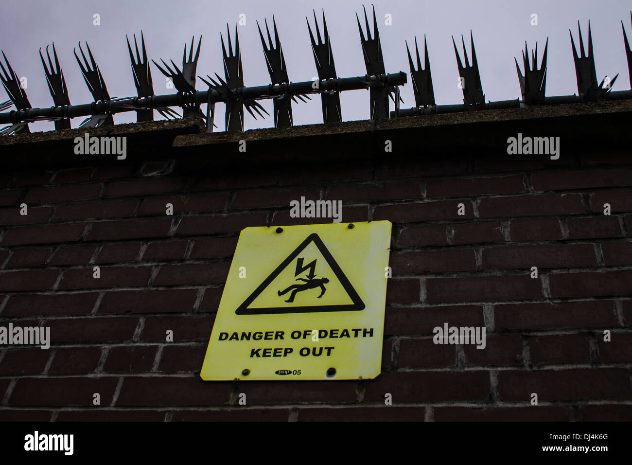Danger sign and barbed wire Stock Photo - Alamy
