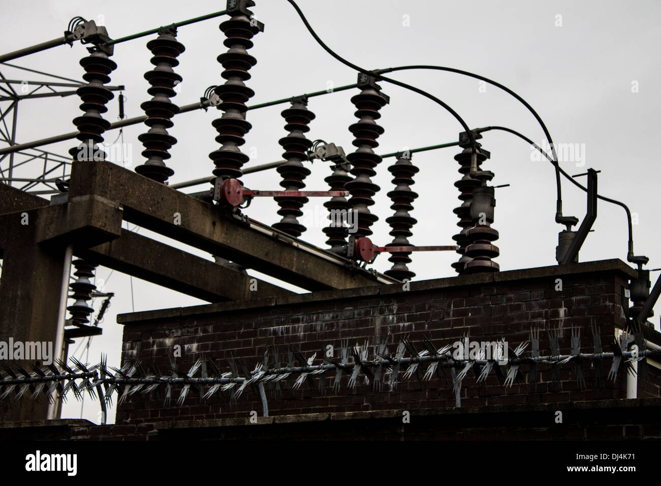A substation, barbed wire and pylon Stock Photo - Alamy