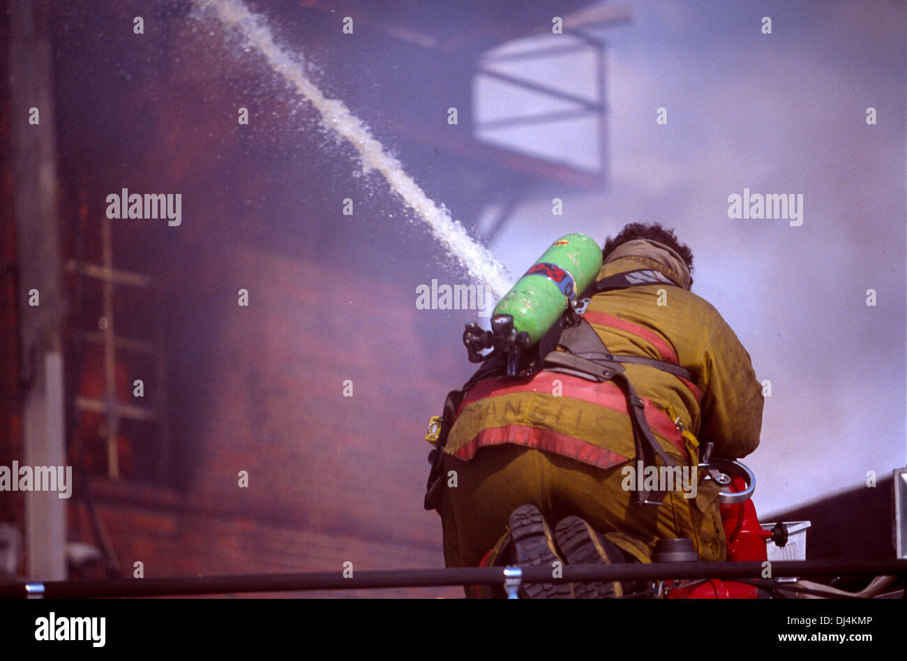 Fireman putting out building fire hi-res stock photography and images ...