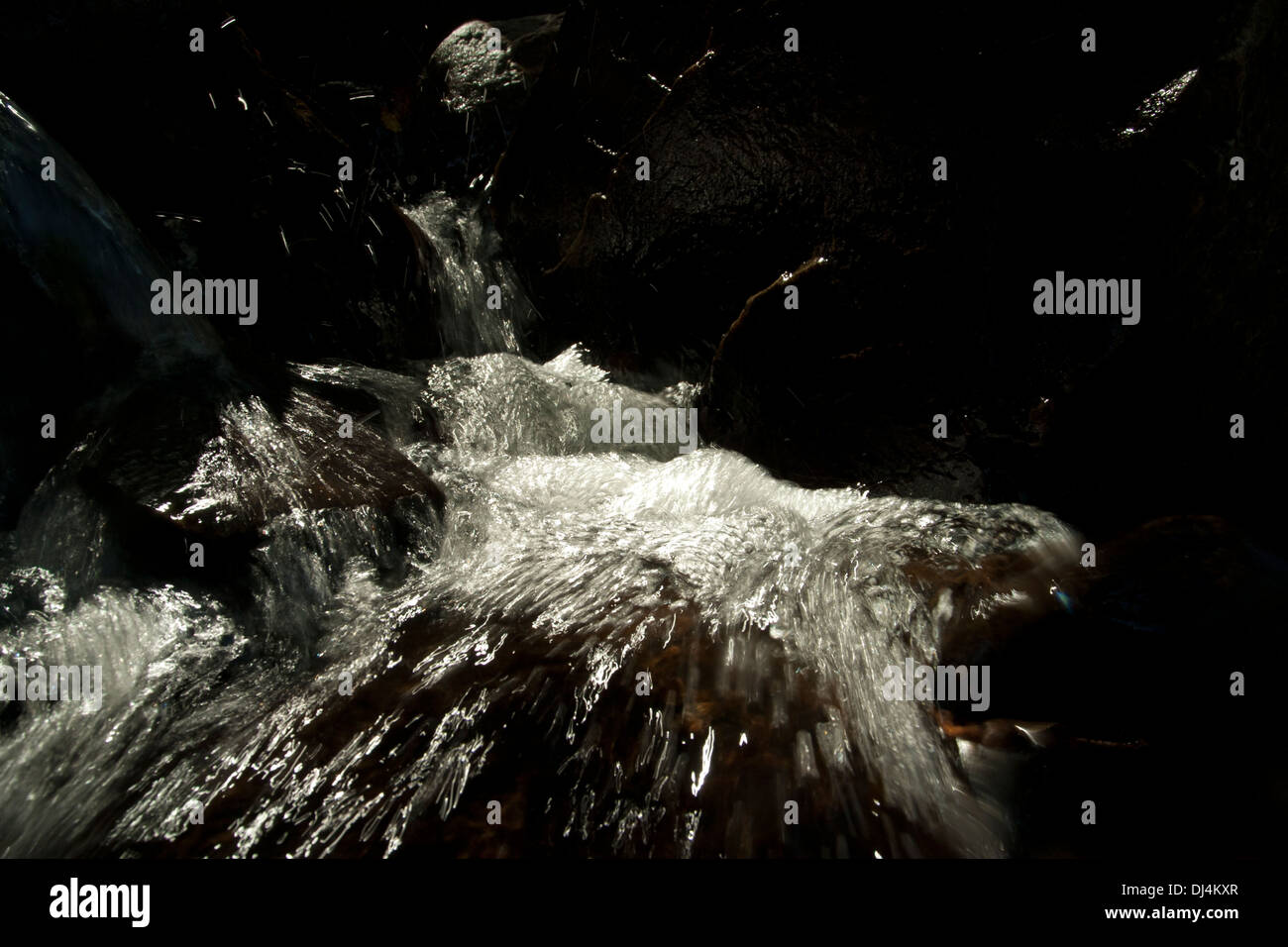 Rushing water in a Vermont waterfall in summer sunlight Stock Photo - Alamy