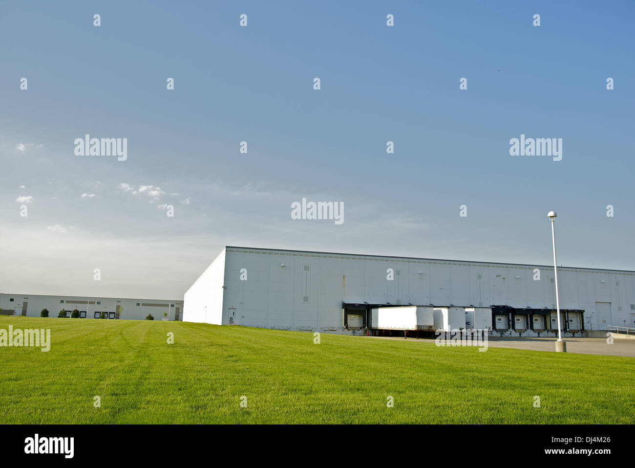 Industrial Zone - Warehouses with Truck Gates and Green Field ...