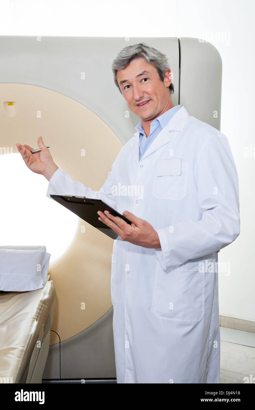 Doctor Presenting The CT Scan Machine Stock Photo - Alamy