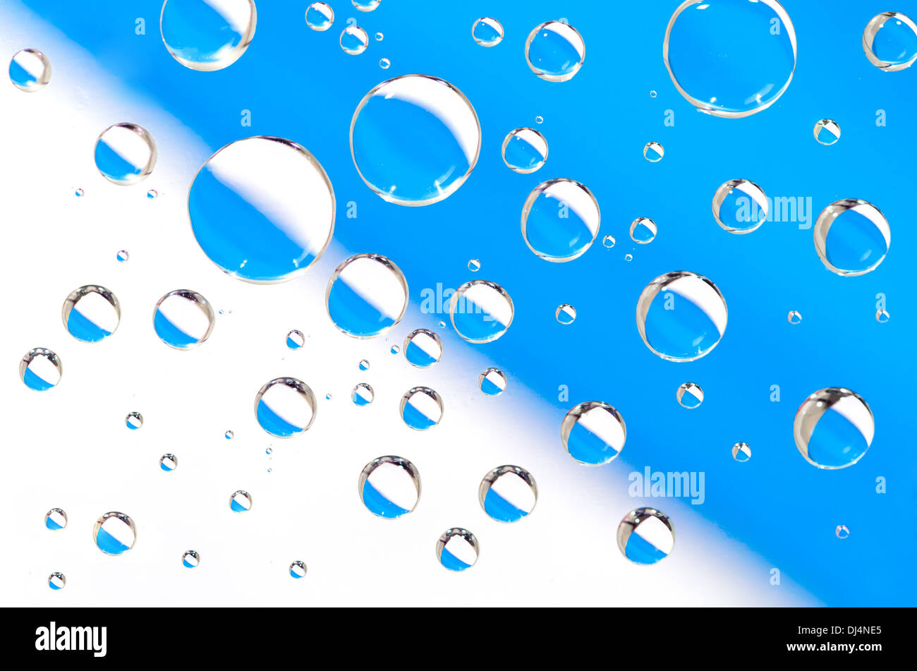 Water droplets on a white-blue background Stock Photo - Alamy
