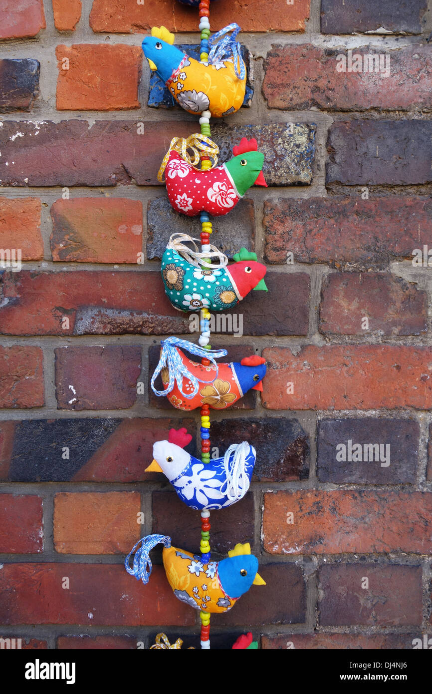 Fair Trade decorative chicken wall hanging Stock Photo - Alamy