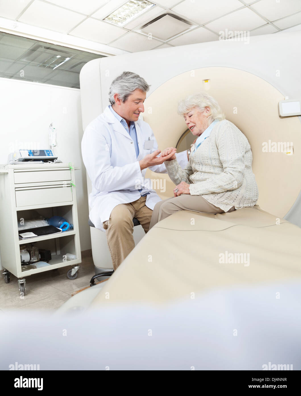 Radiologist Comforting Female Patient Stock Photo - Alamy