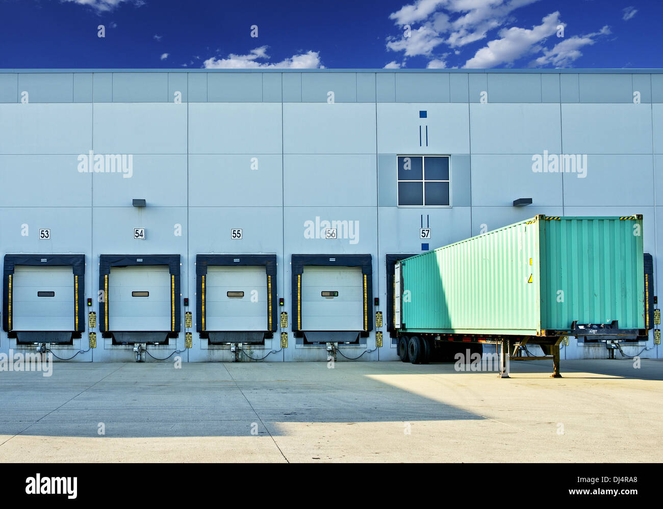 Trailer in a Dock. Warehouse Building with Gates. Business and ...