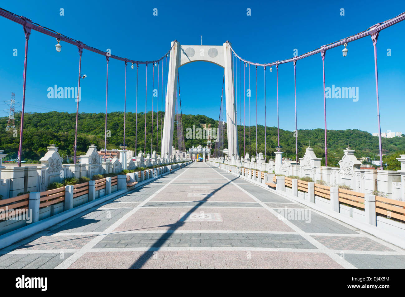 Brick footbridge to green hill Stock Photo - Alamy