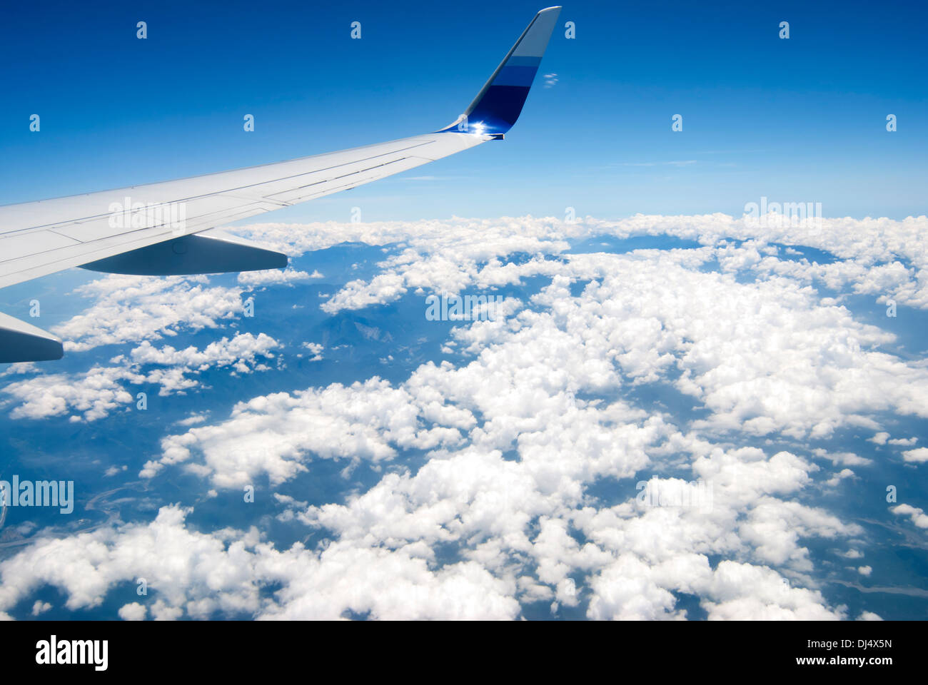 Airplane fly above land Stock Photo - Alamy