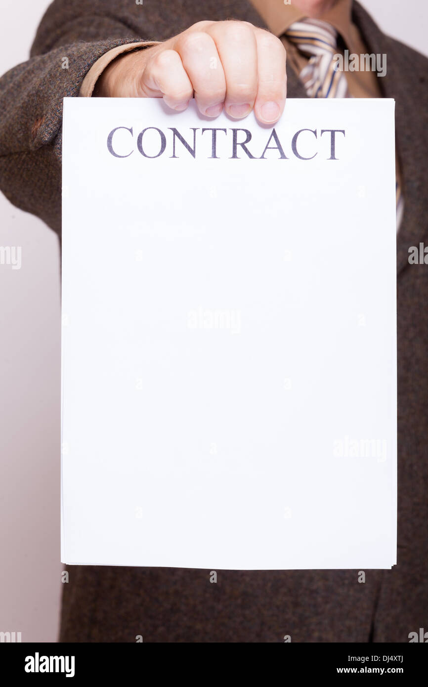 Business concept. Businessman holding blank empty paper sheet with sign ...