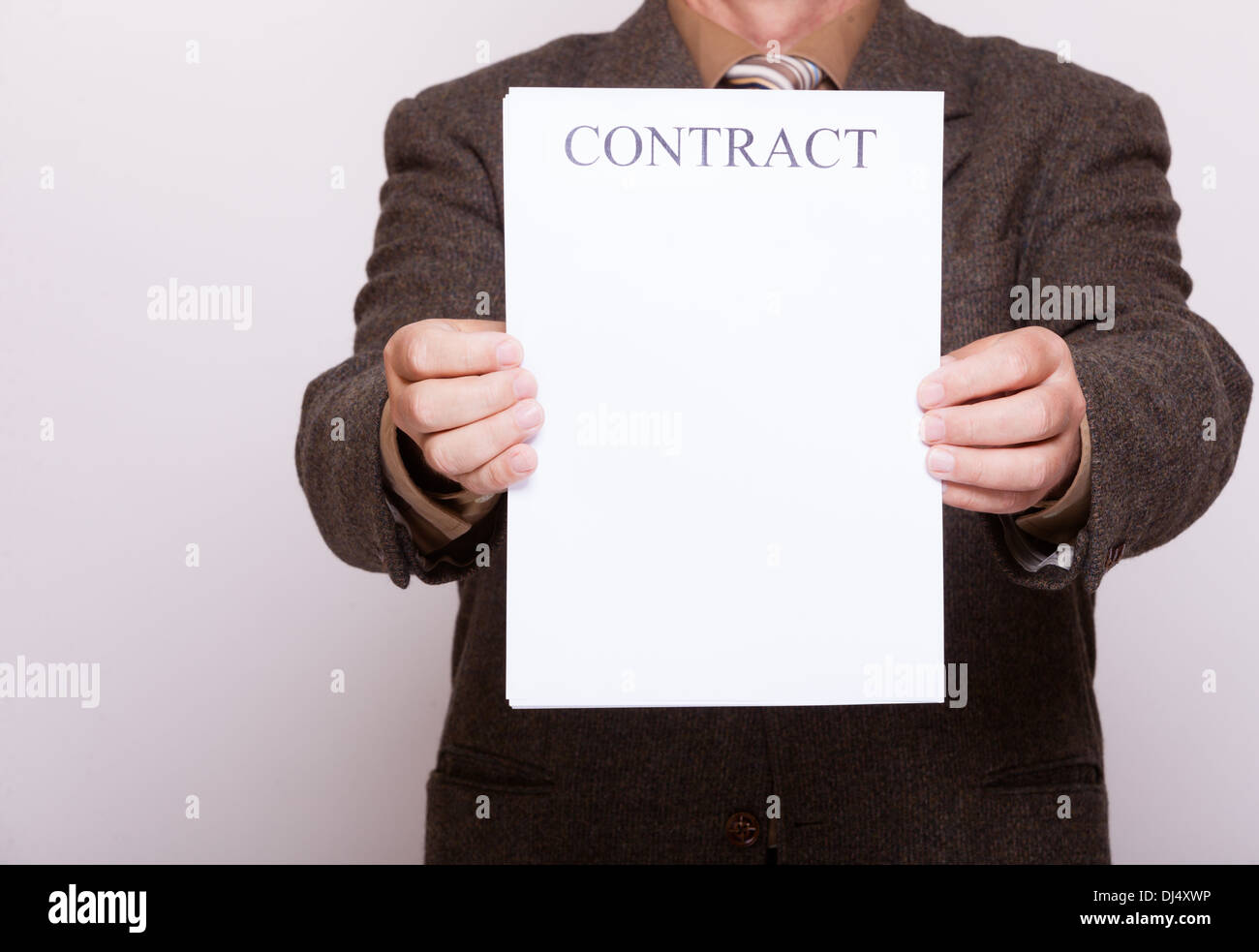 Business concept. Businessman holding blank empty paper sheet with sign ...