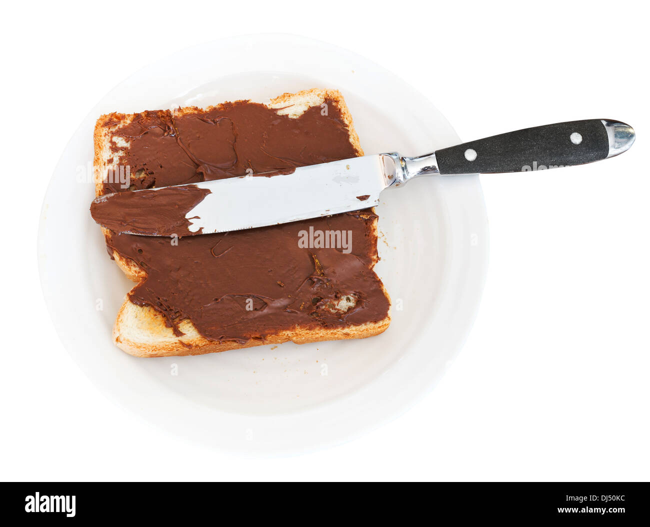 top view of fresh toast with chocolate spread on white plate, table ...