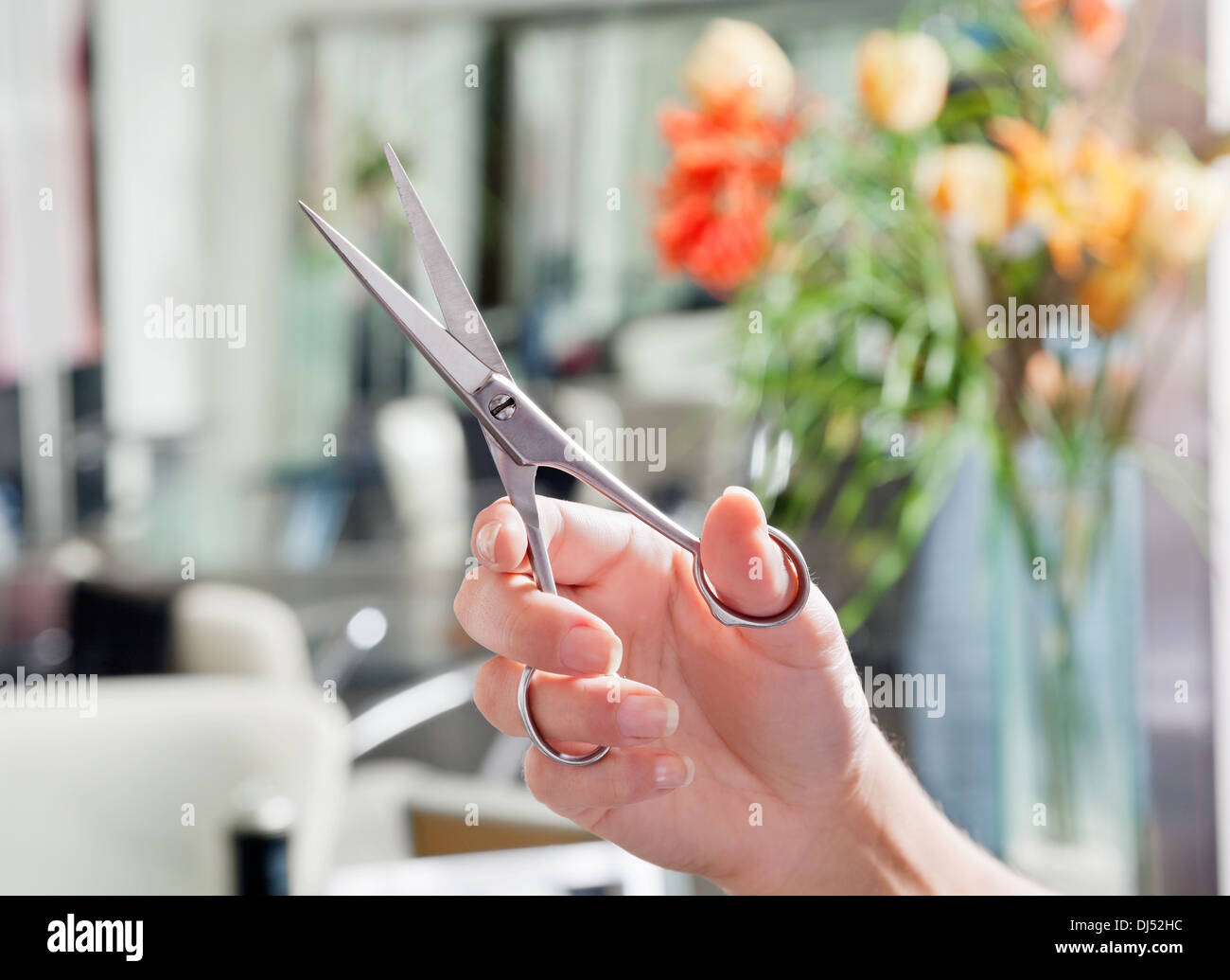 Hairdresser's Hand Holding Scissors Stock Photo - Alamy
