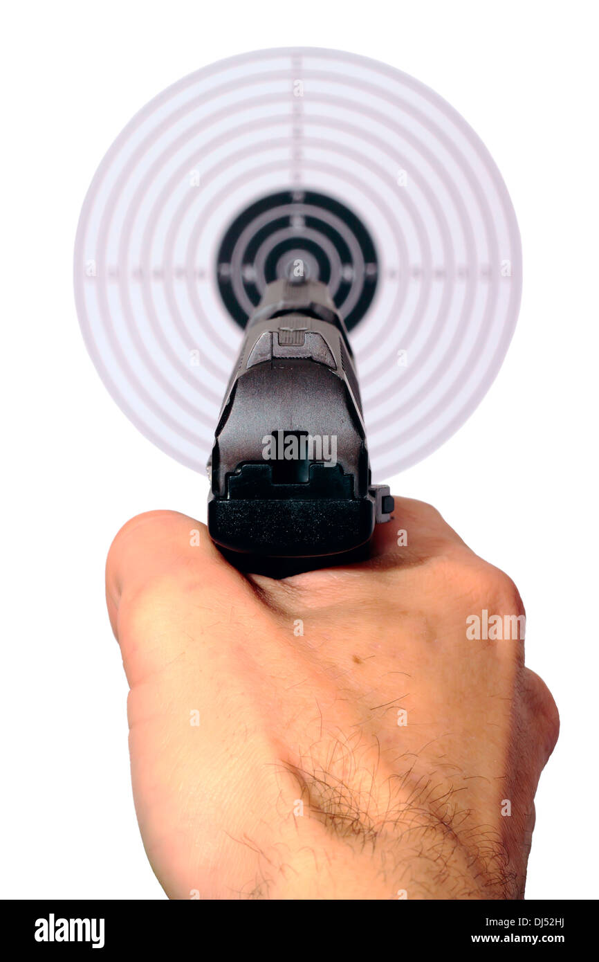 Hand with a gun pointing at the target Stock Photo - Alamy