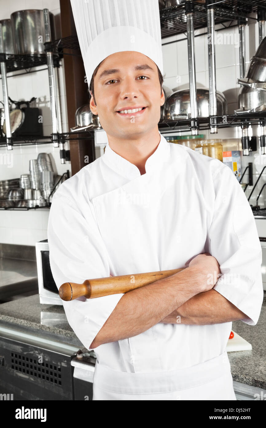 Happy Chef Standing With Arms Crossed Stock Photo - Alamy
