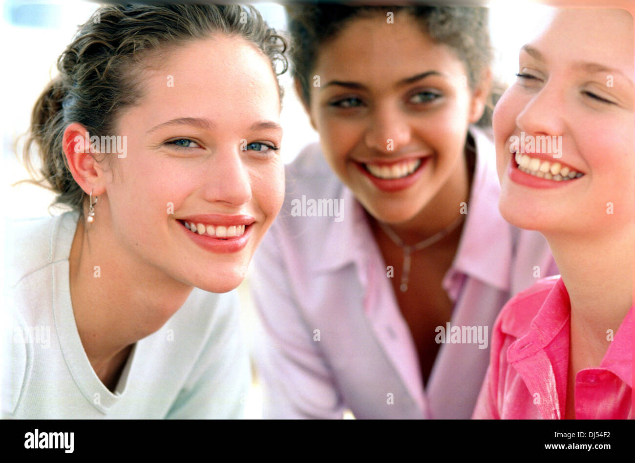 Three smiling teenage girls Stock Photo - Alamy