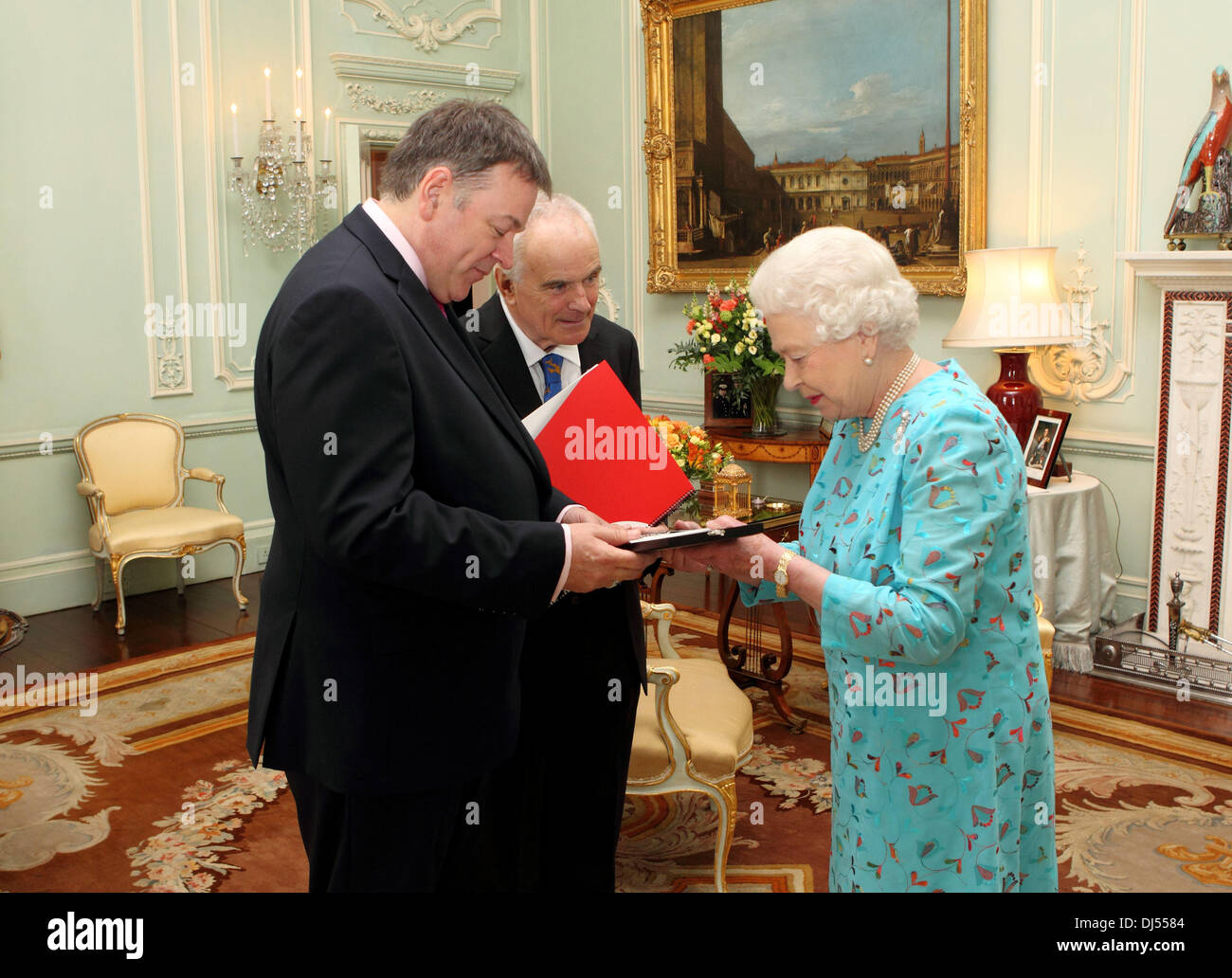 Queen Elizabeth II presents Nicholas Daniel (left) with the Queen's ...