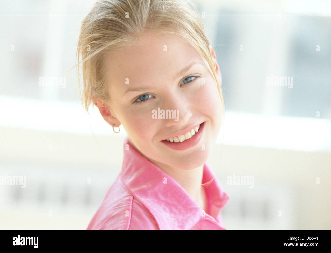 Portrait of January Jones woman with blonde hair off face looking to ...