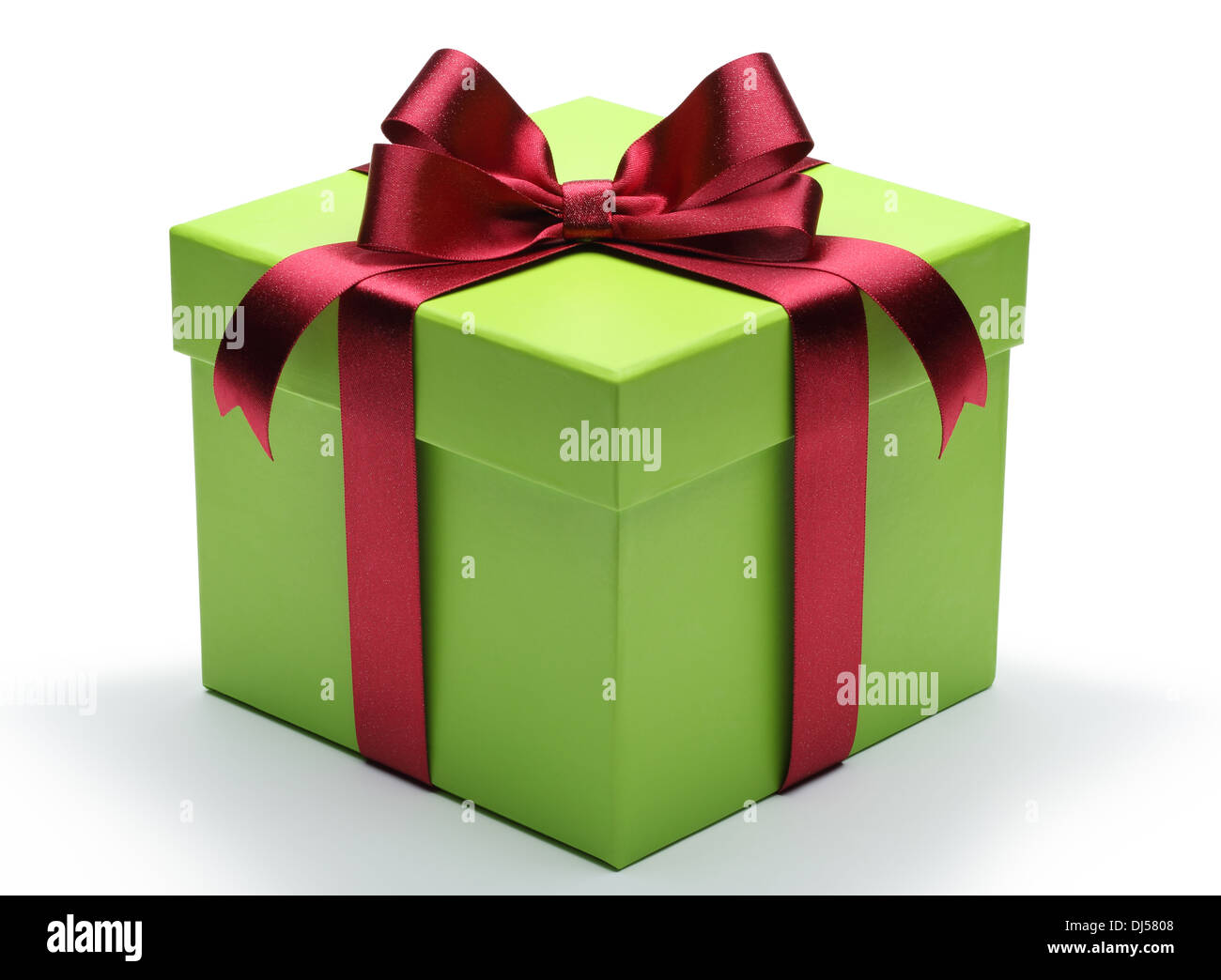 Green gift box with red ribbon bow isolated on white background Stock ...