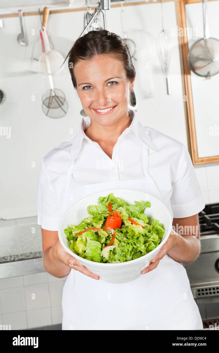 Female Chef Showing Vegetable Salad Stock Photo - Alamy