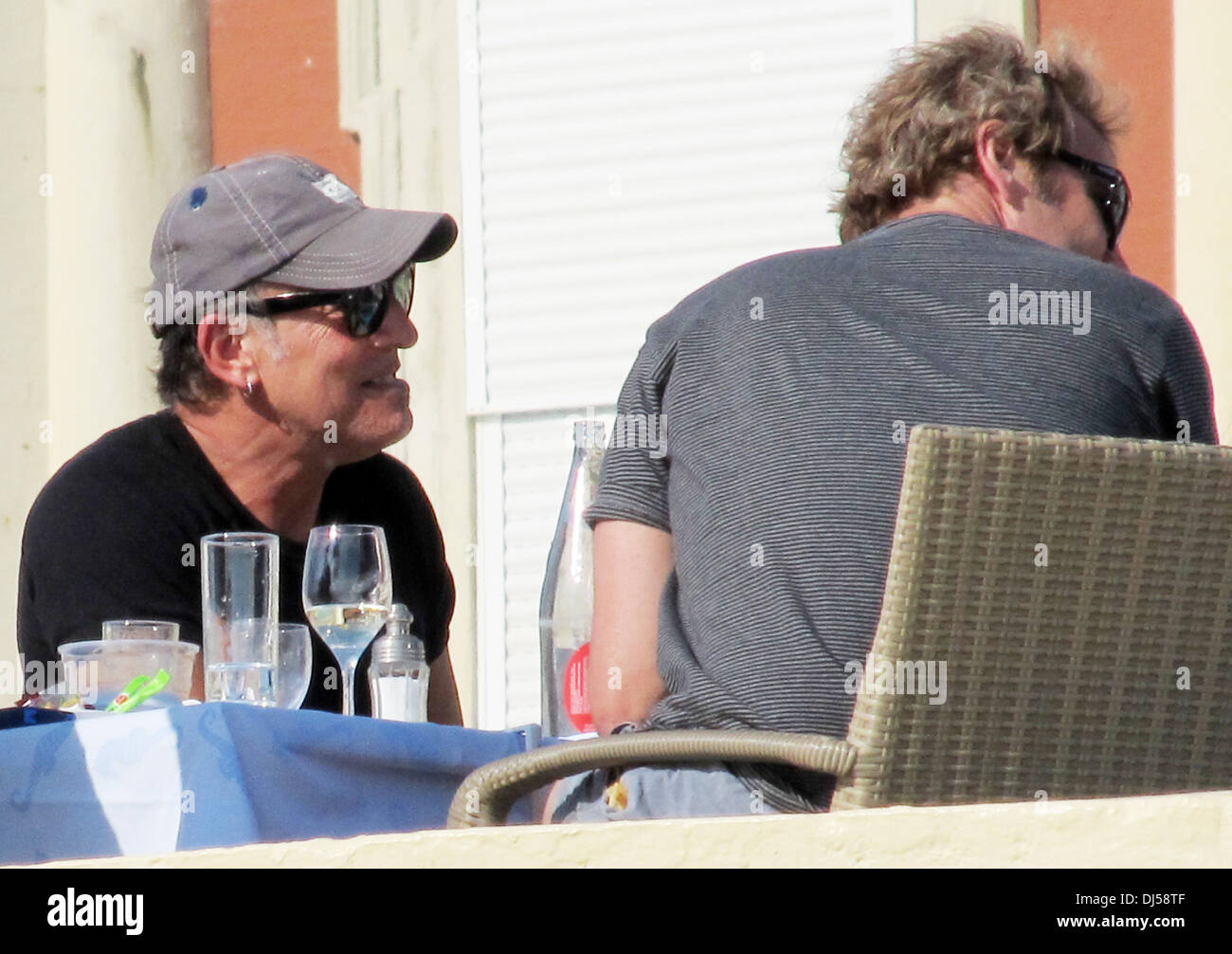 Bruce Springsteen having a drink with friends outside Hotel du Palais ...