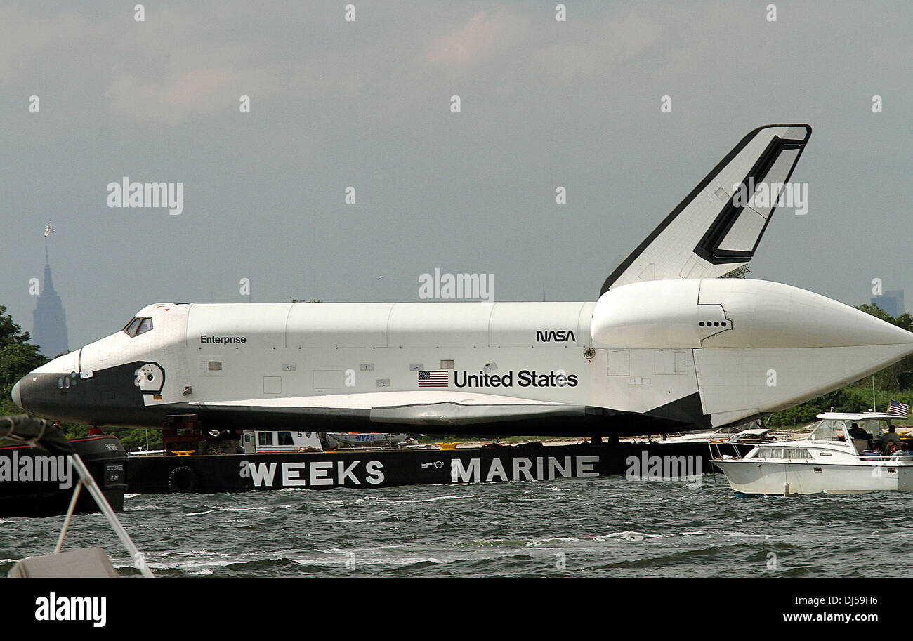 Space Shuttle Enterprise is carried by barge underneath The Gil Hodges ...
