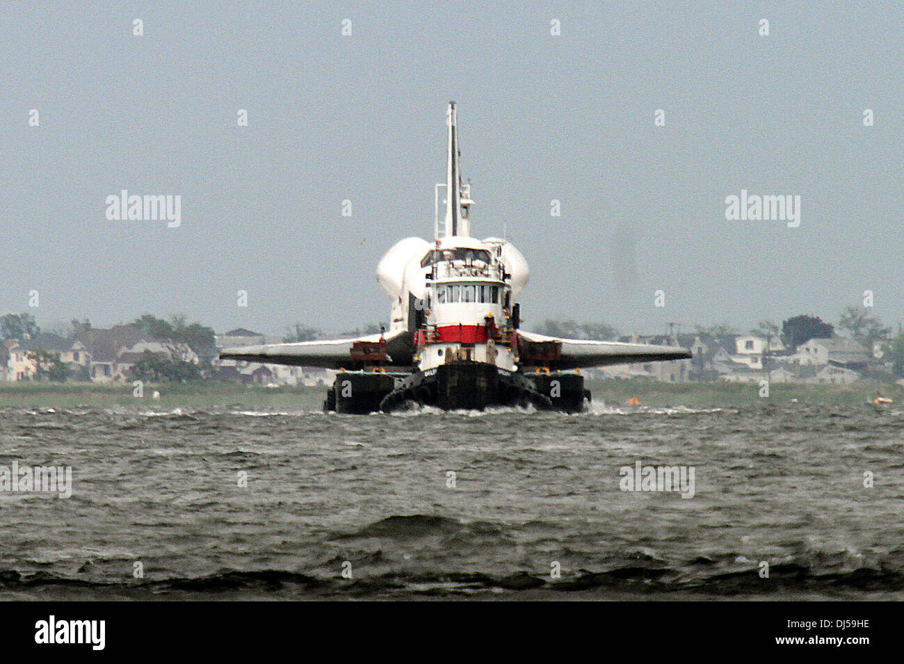 Space Shuttle Enterprise is carried by barge underneath The Gil Hodges ...