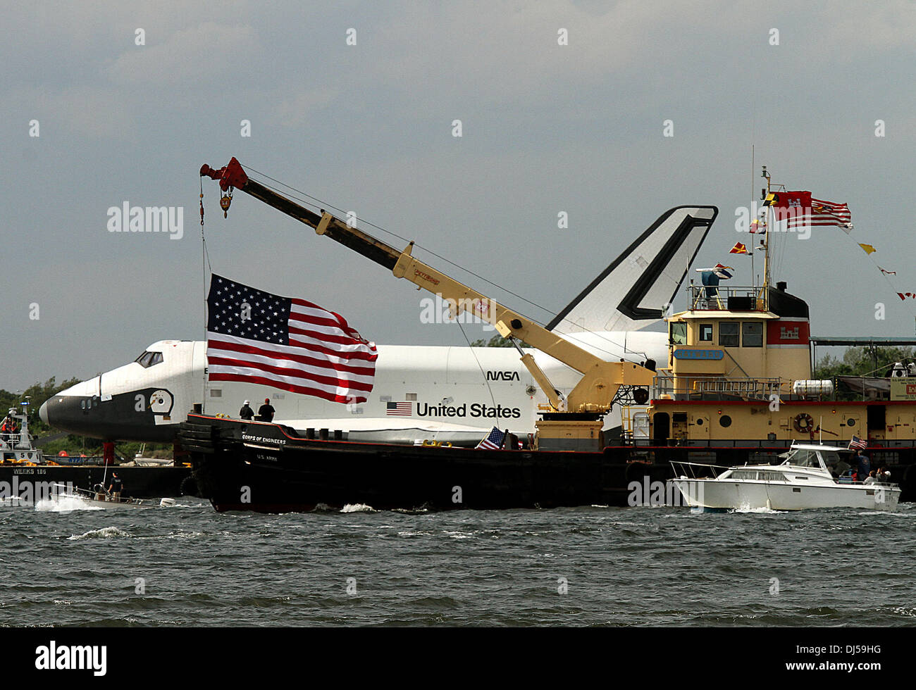 Space Shuttle Enterprise is carried by barge underneath The Gil Hodges ...