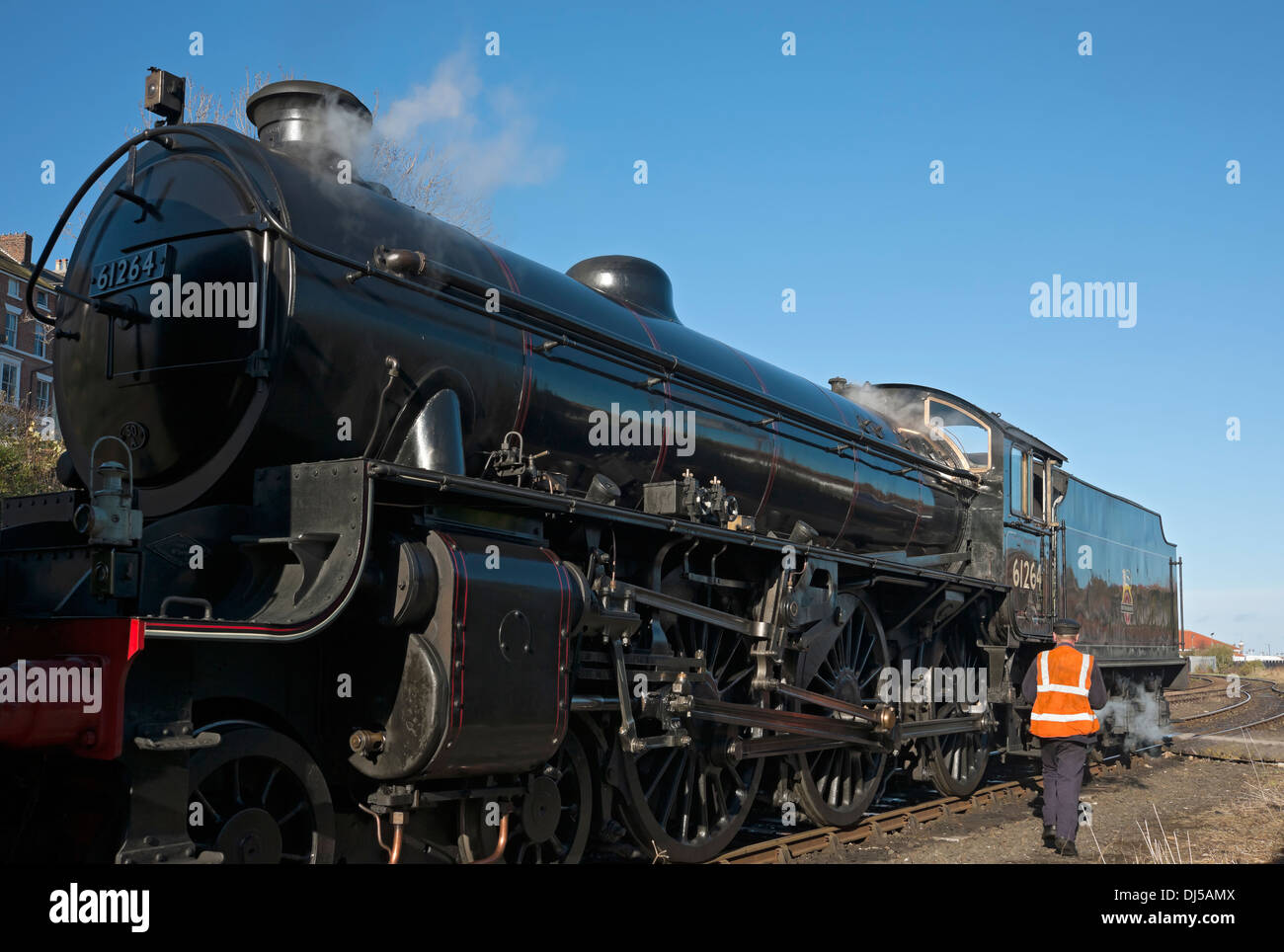 Steam engine train locomotive 61264 on the line track near the Railway ...