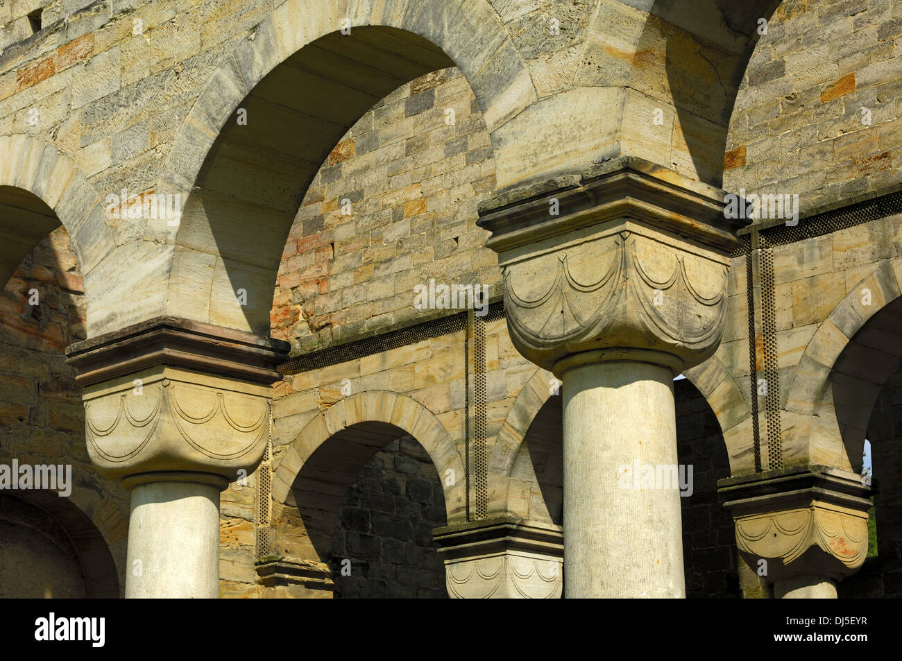 Round columns with a romanesque capital Stock Photo - Alamy