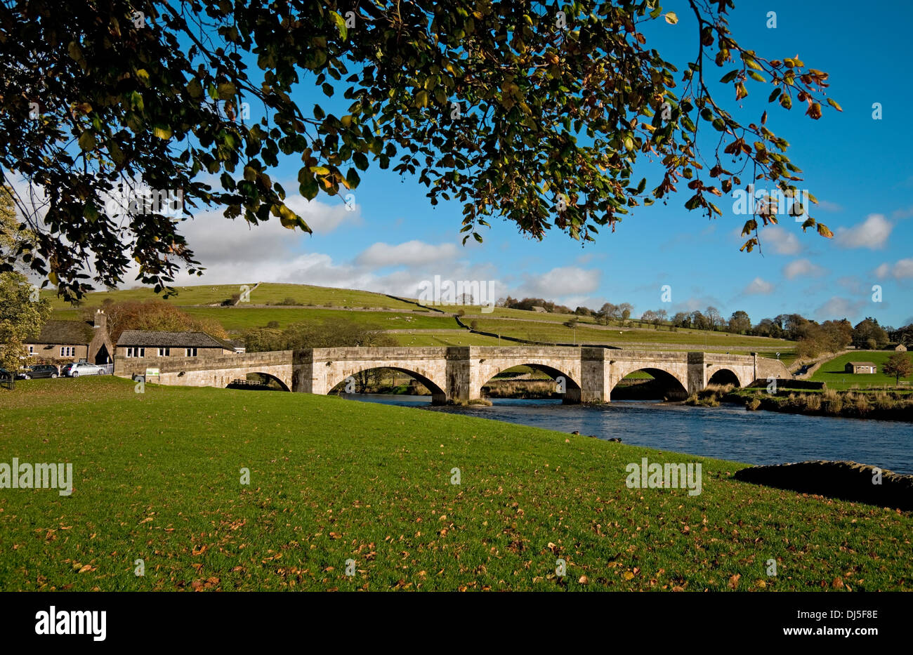 Bridge across River Wharfe in autumn Burnsall Lower Wharfedale ...