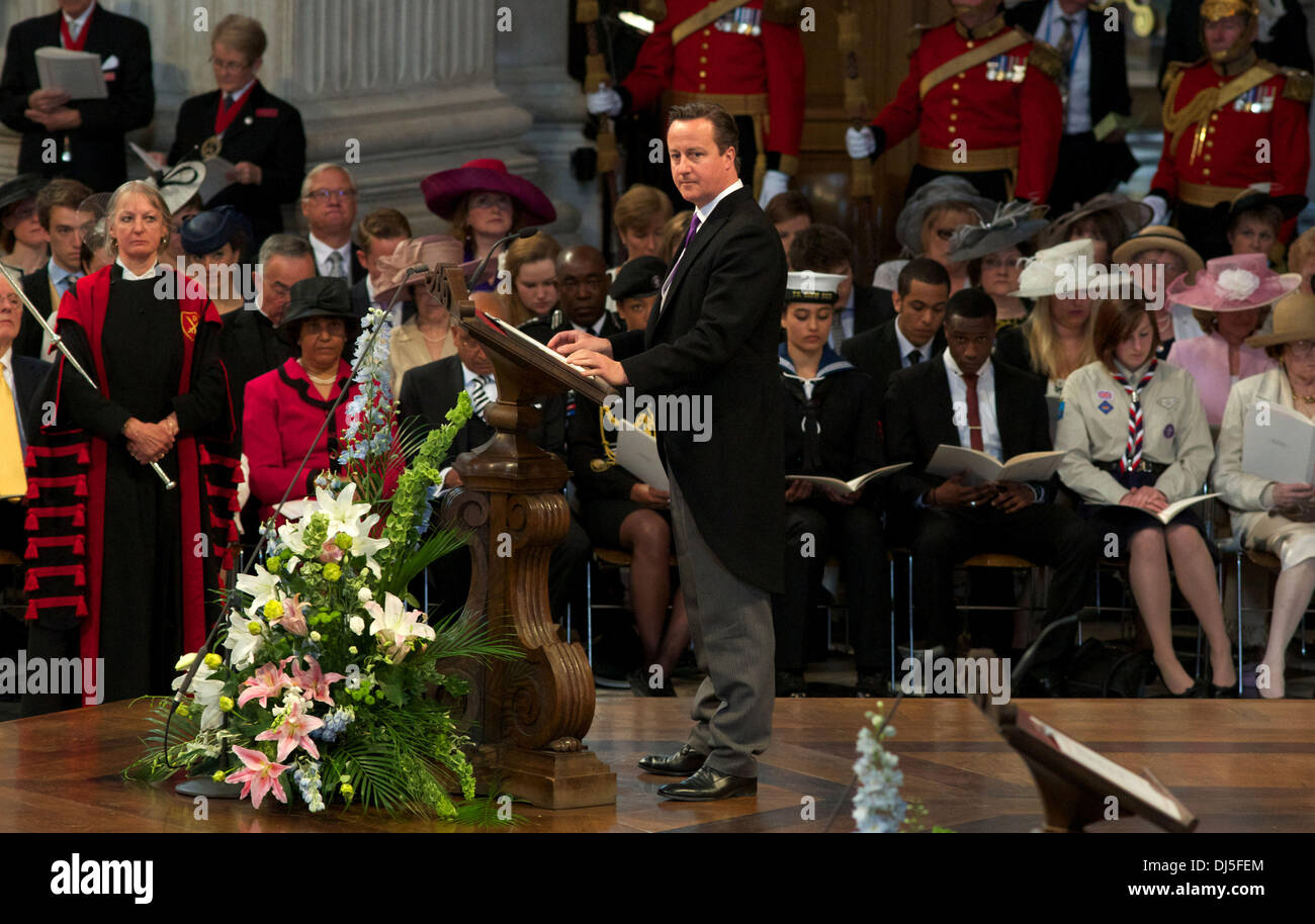 British Prime Minister David Cameron stands a lectern during a national ...