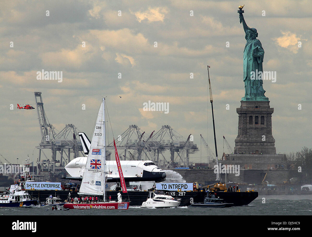 The NASA space shuttle prototype Enterprise is lowered by crane into ...