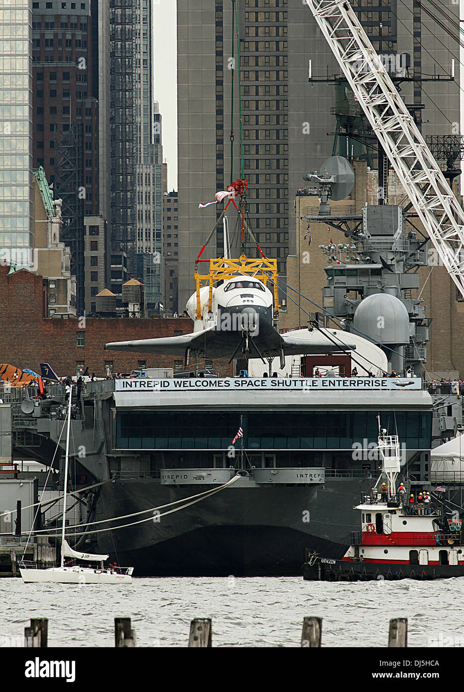 The NASA space shuttle prototype Enterprise is lowered by crane into ...