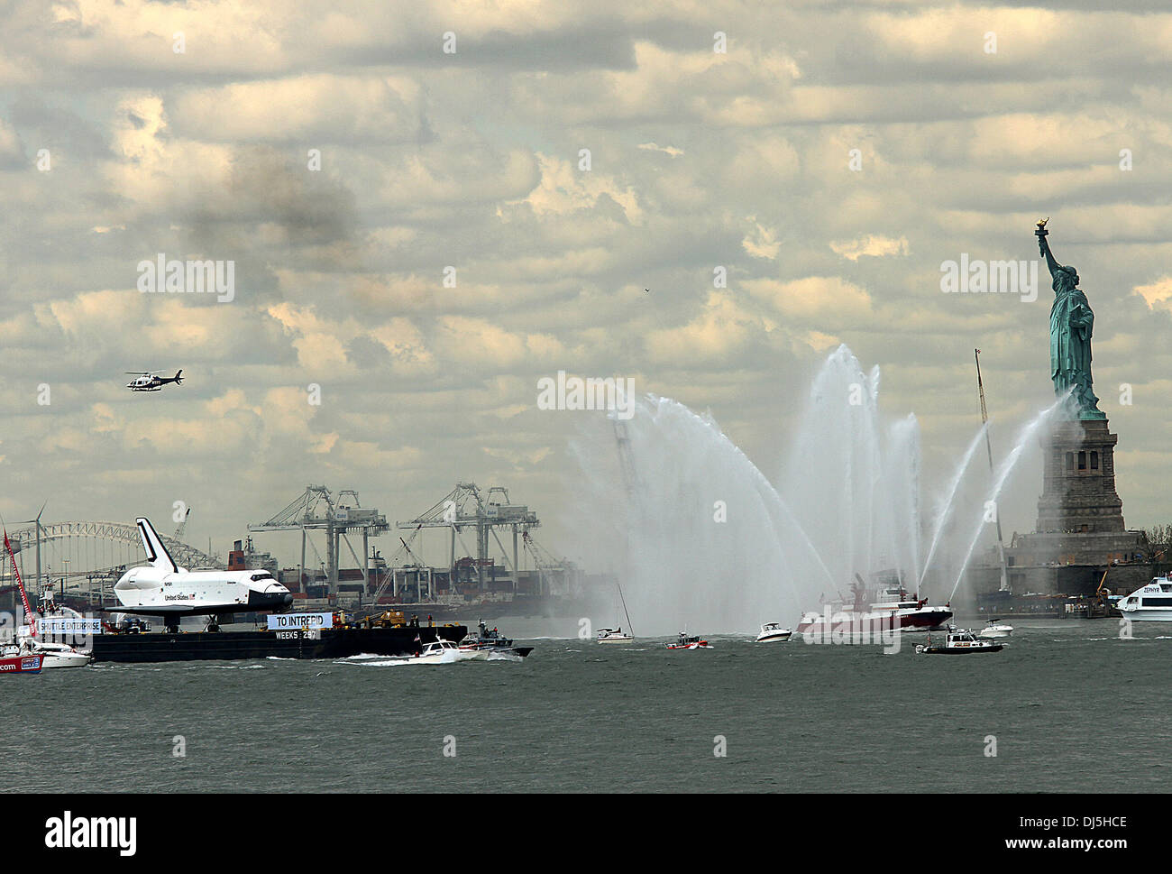 The NASA space shuttle prototype Enterprise is lowered by crane into ...