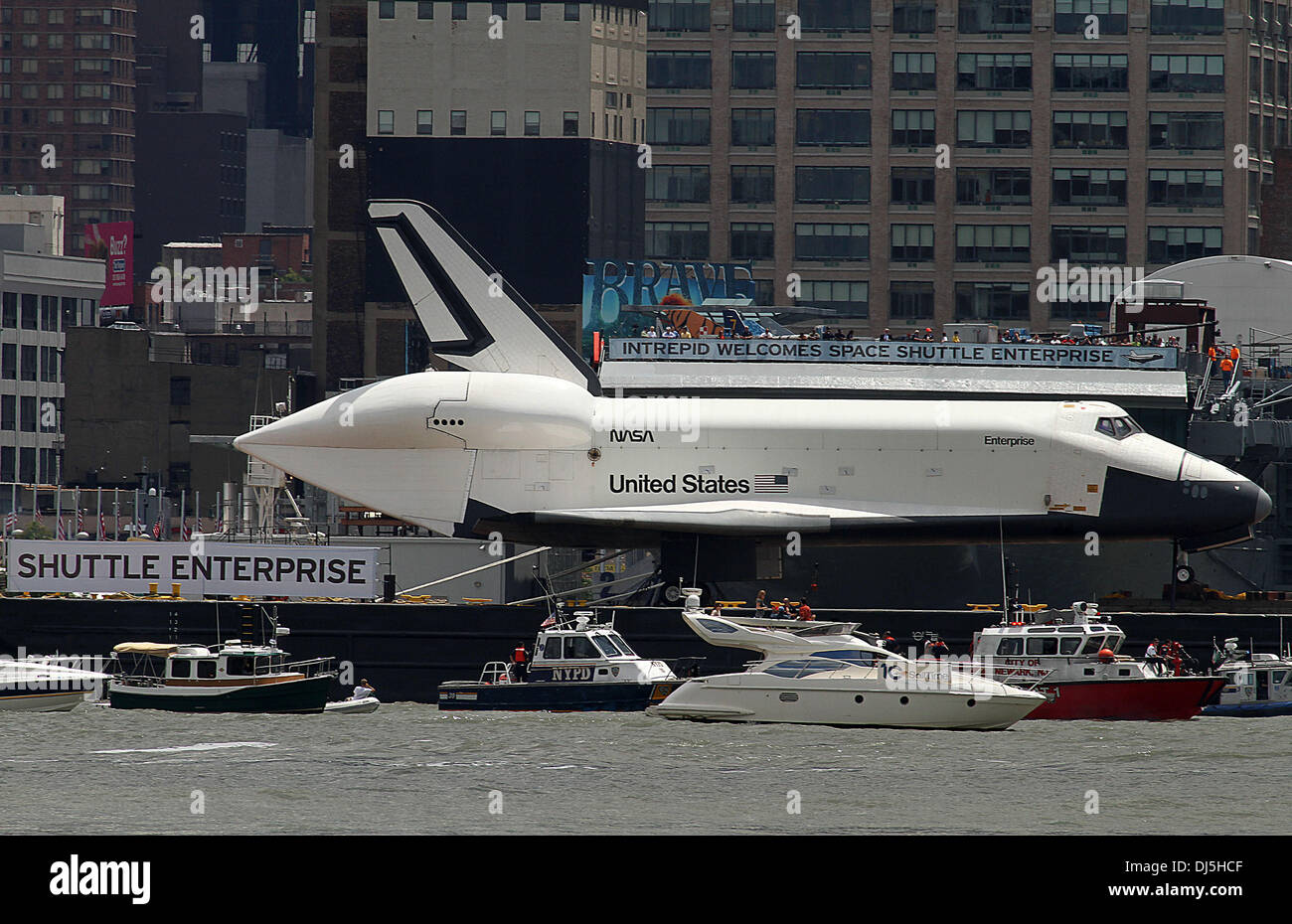 The NASA space shuttle prototype Enterprise is lowered by crane into ...