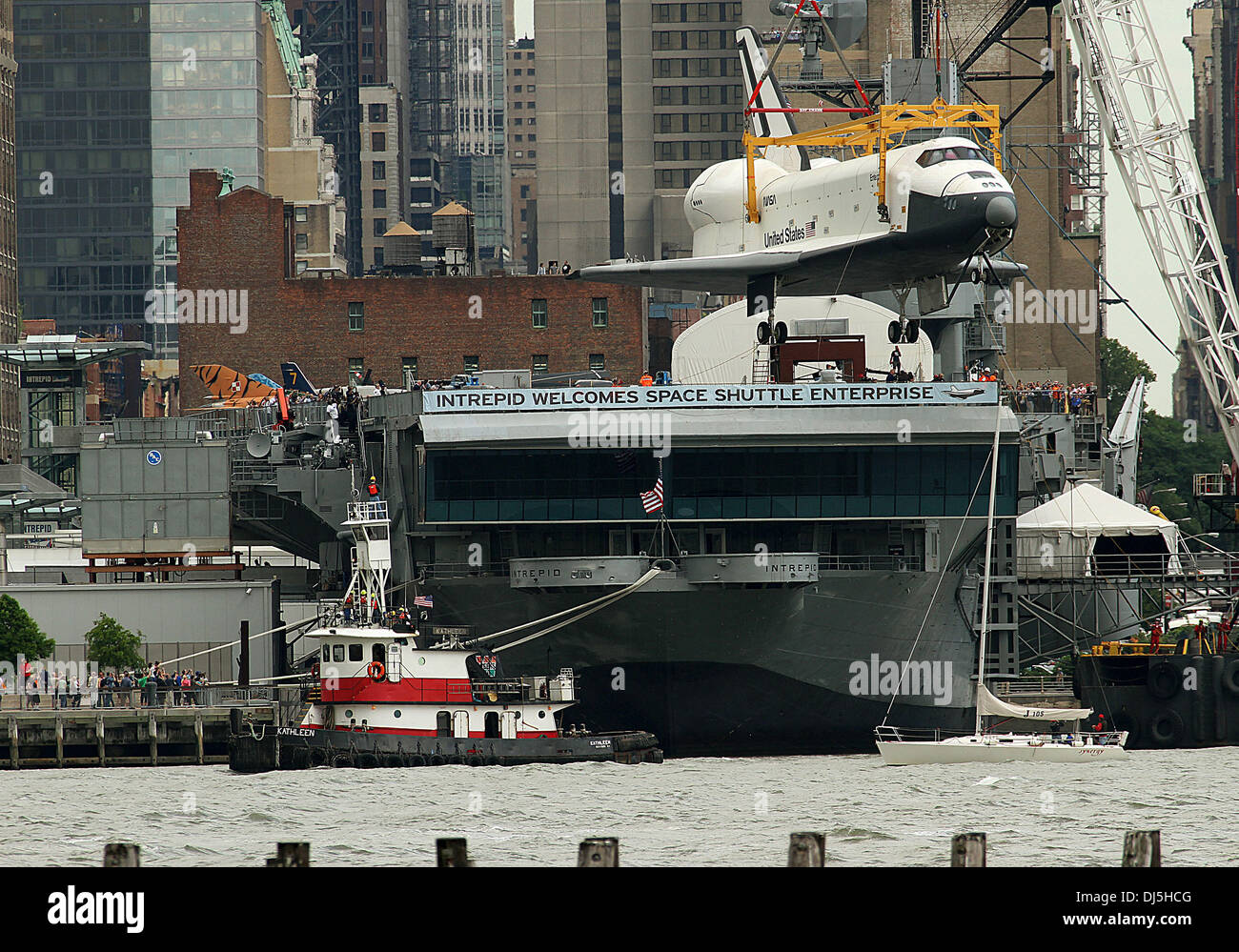 The NASA space shuttle prototype Enterprise is lowered by crane into ...