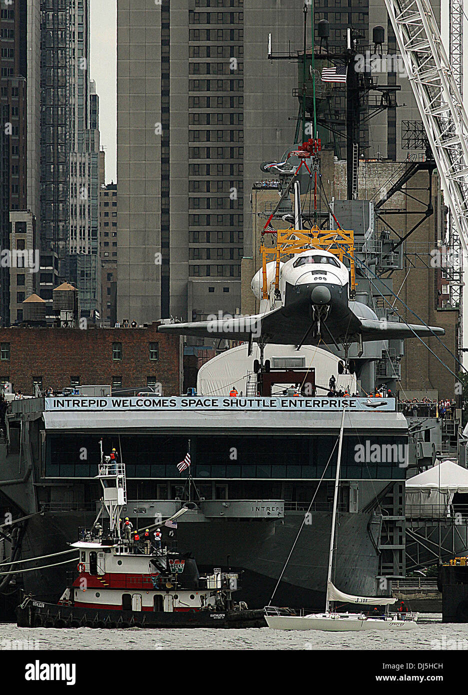 The NASA space shuttle prototype Enterprise is lowered by crane into ...